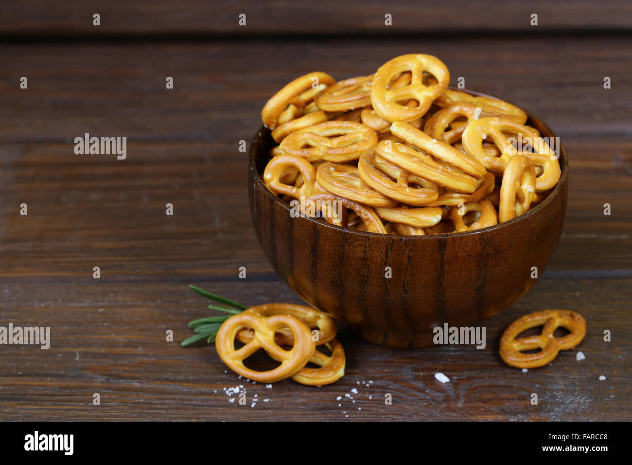 Salty snacks mini pretzels with salt and spices Stock Photo - Alamy