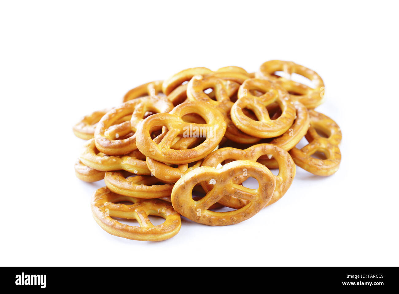 Salty snacks mini pretzels with salt and spices Stock Photo - Alamy