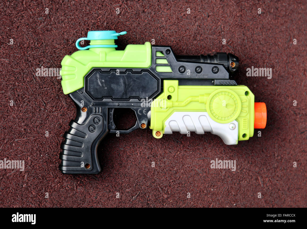 it's a photo of a water gun lying on the ground floor Stock Photo - Alamy