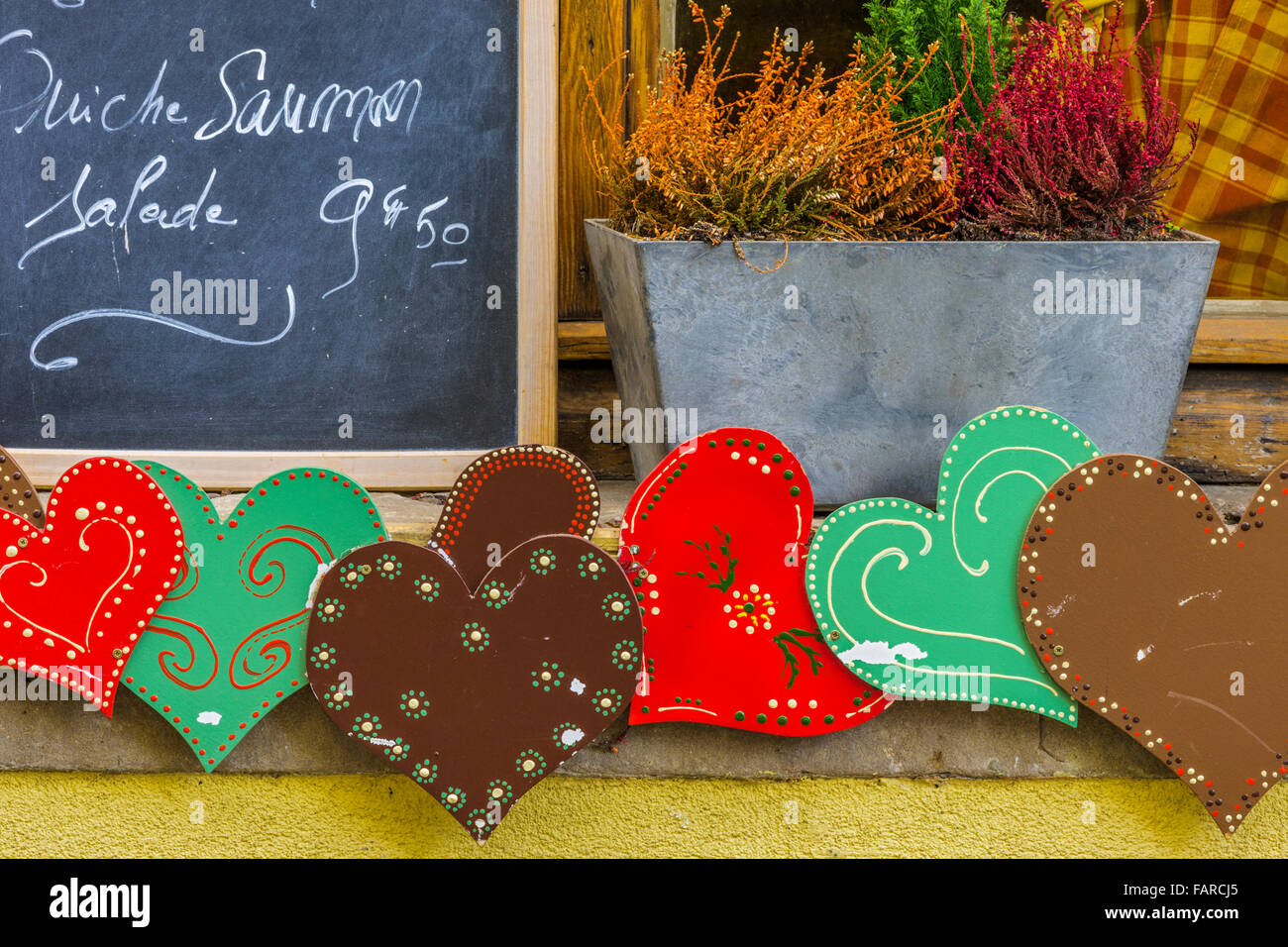 Restaurant window with heart decorations in Colmar, France Stock Photo ...