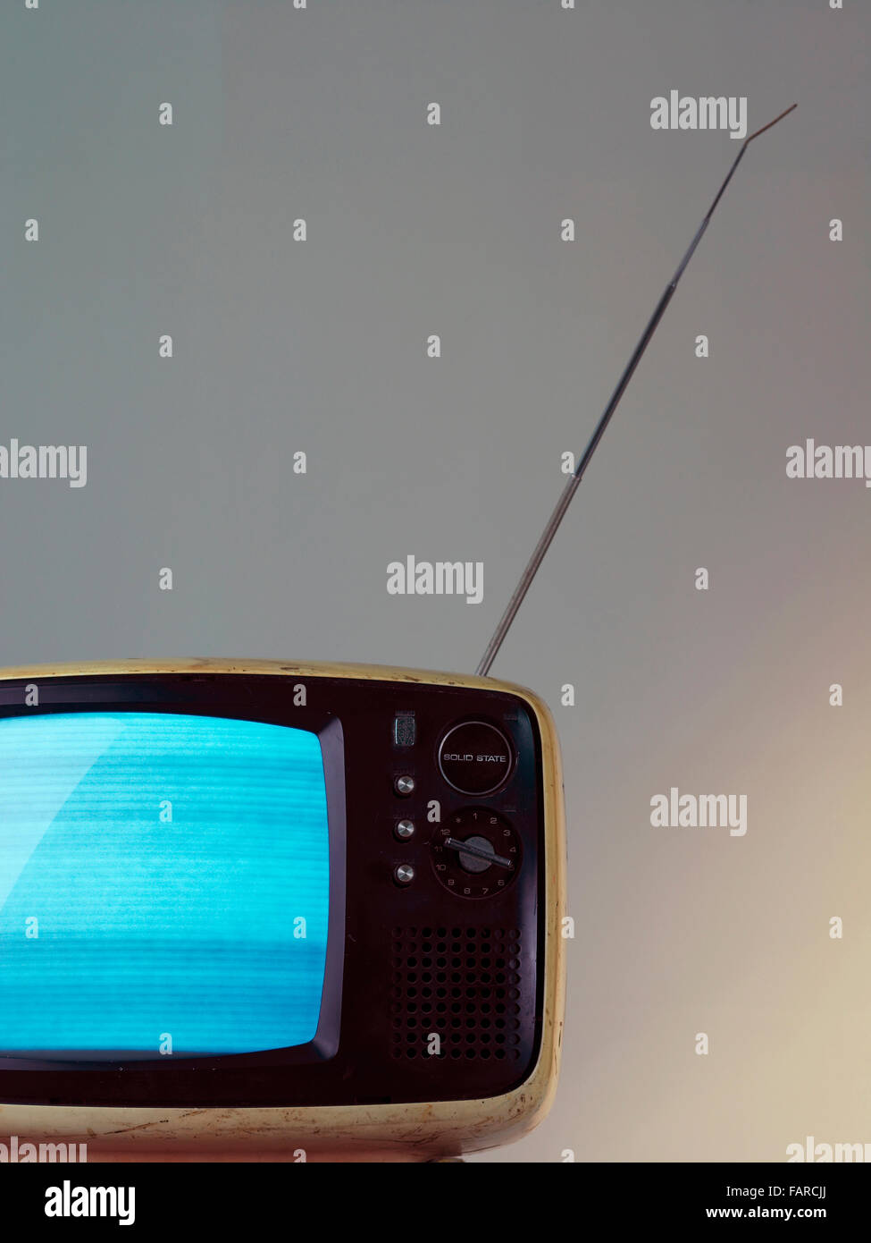 Old televison isolated on greyish background Stock Photo - Alamy