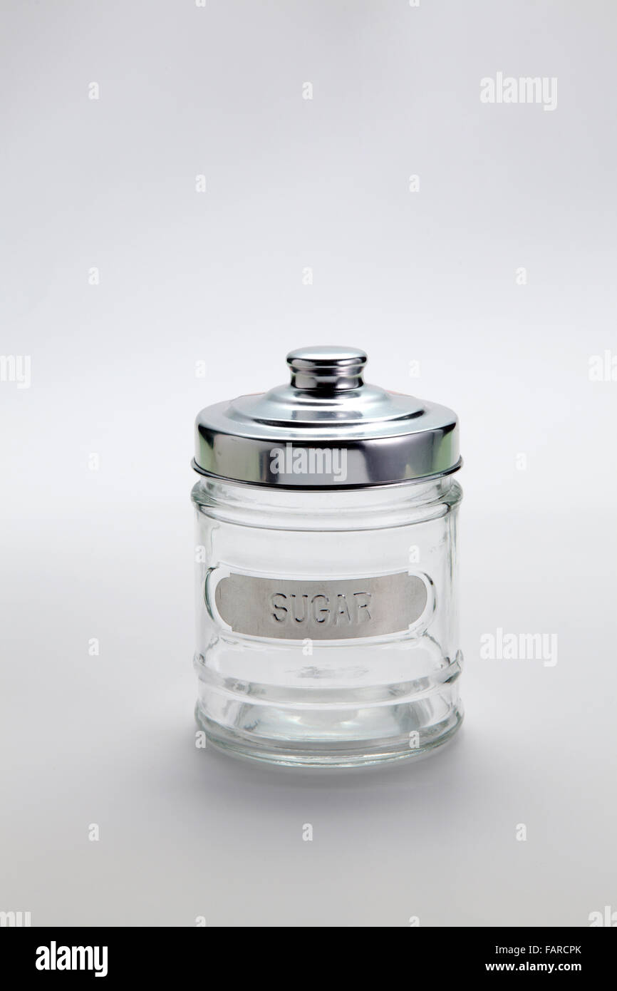 empty sugar container on the plain background Stock Photo - Alamy