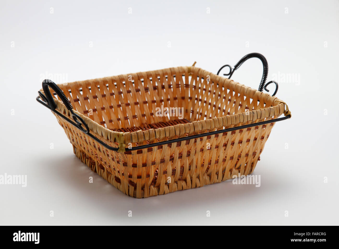 Basket made out of rattan isolated on white background Stock Photo - Alamy
