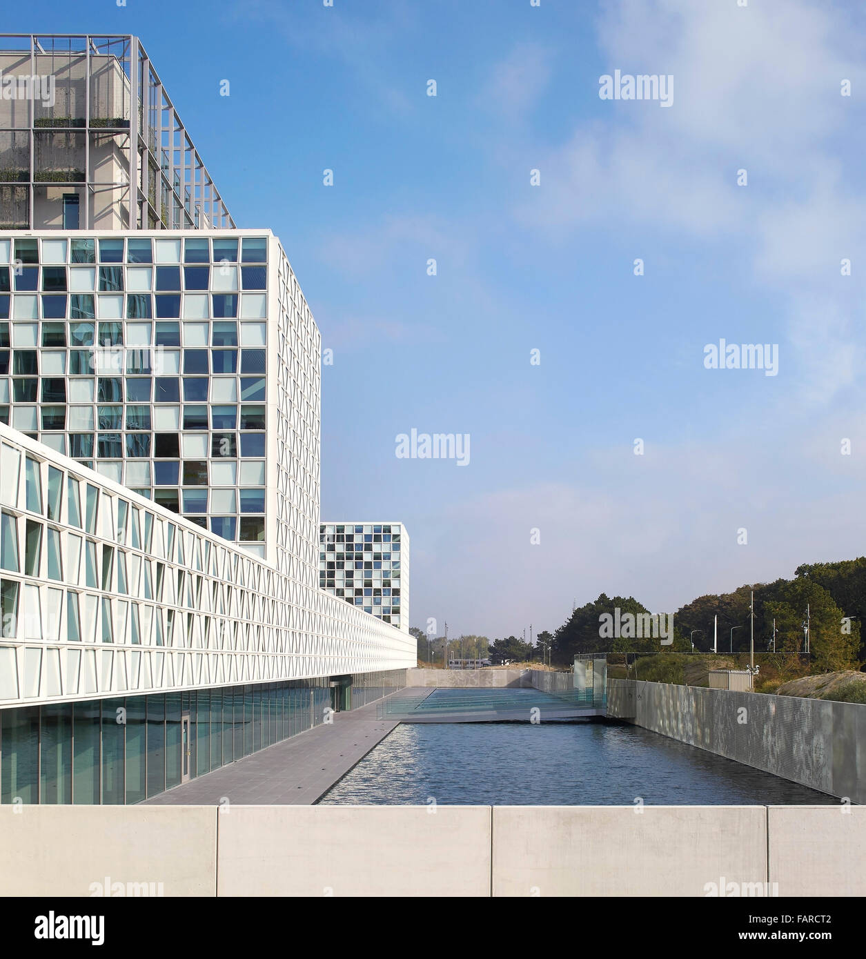 Perspective of office towers with moat-style pond. International ...
