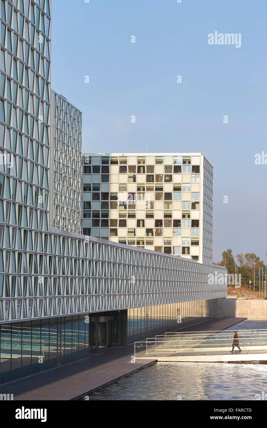 Perspective of office towers with moat-style pond and bridge ...