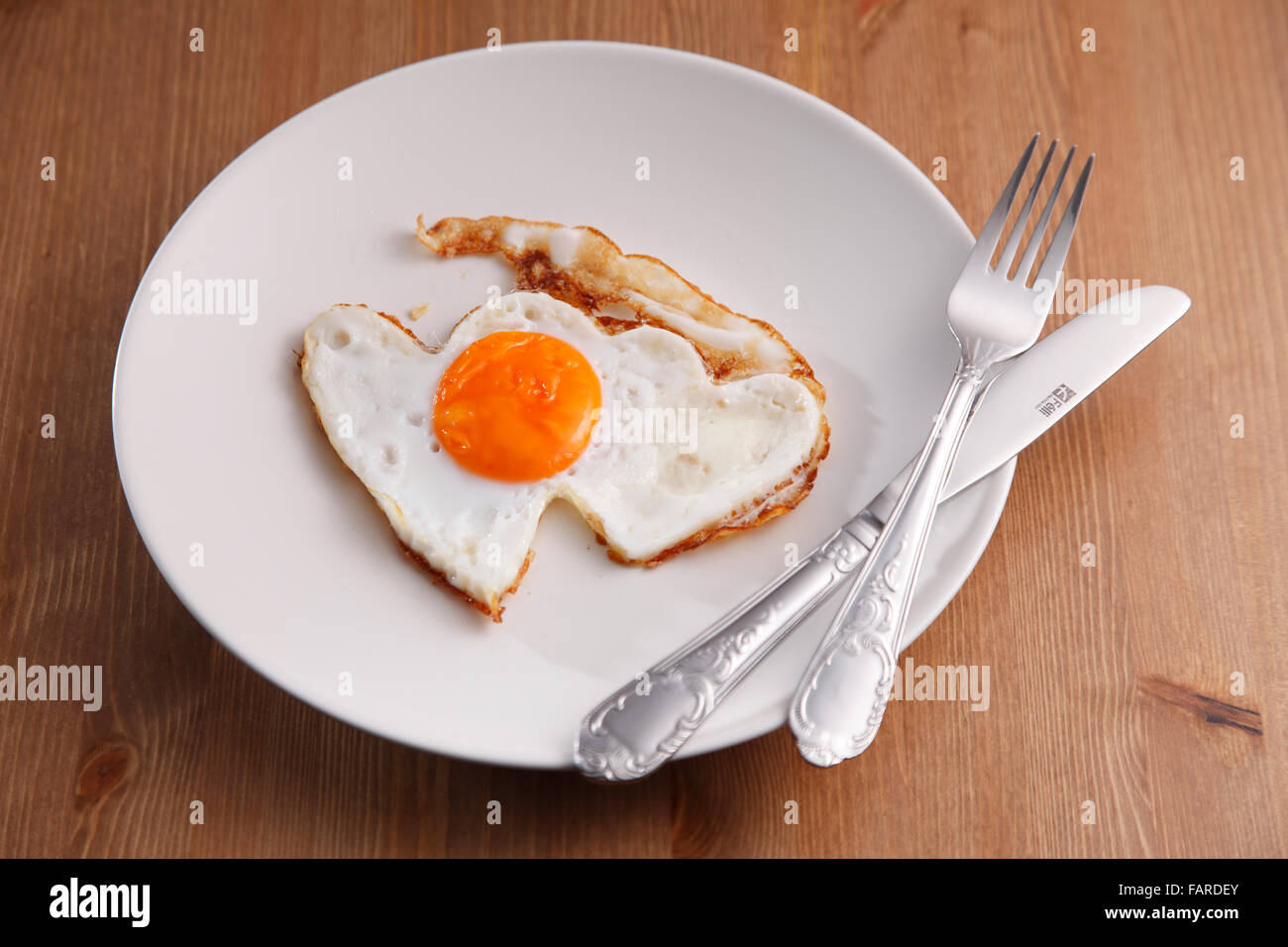 romance breakfast with heart shape fried egg Stock Photo - Alamy