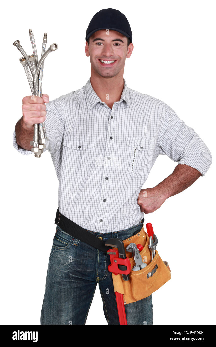 Man holding pipes Stock Photo - Alamy