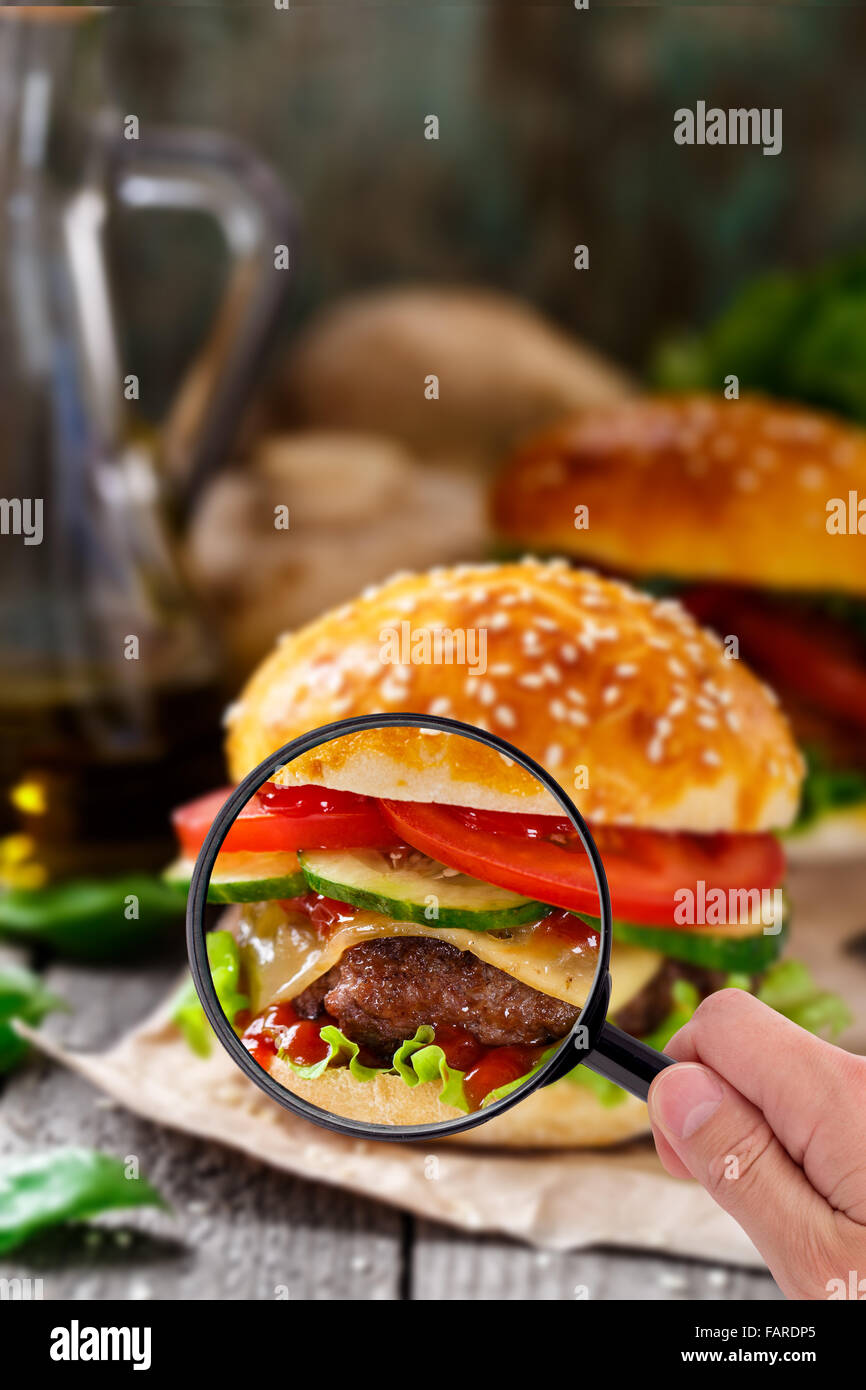 Magnifying glass examining burger hi-res stock photography and images ...