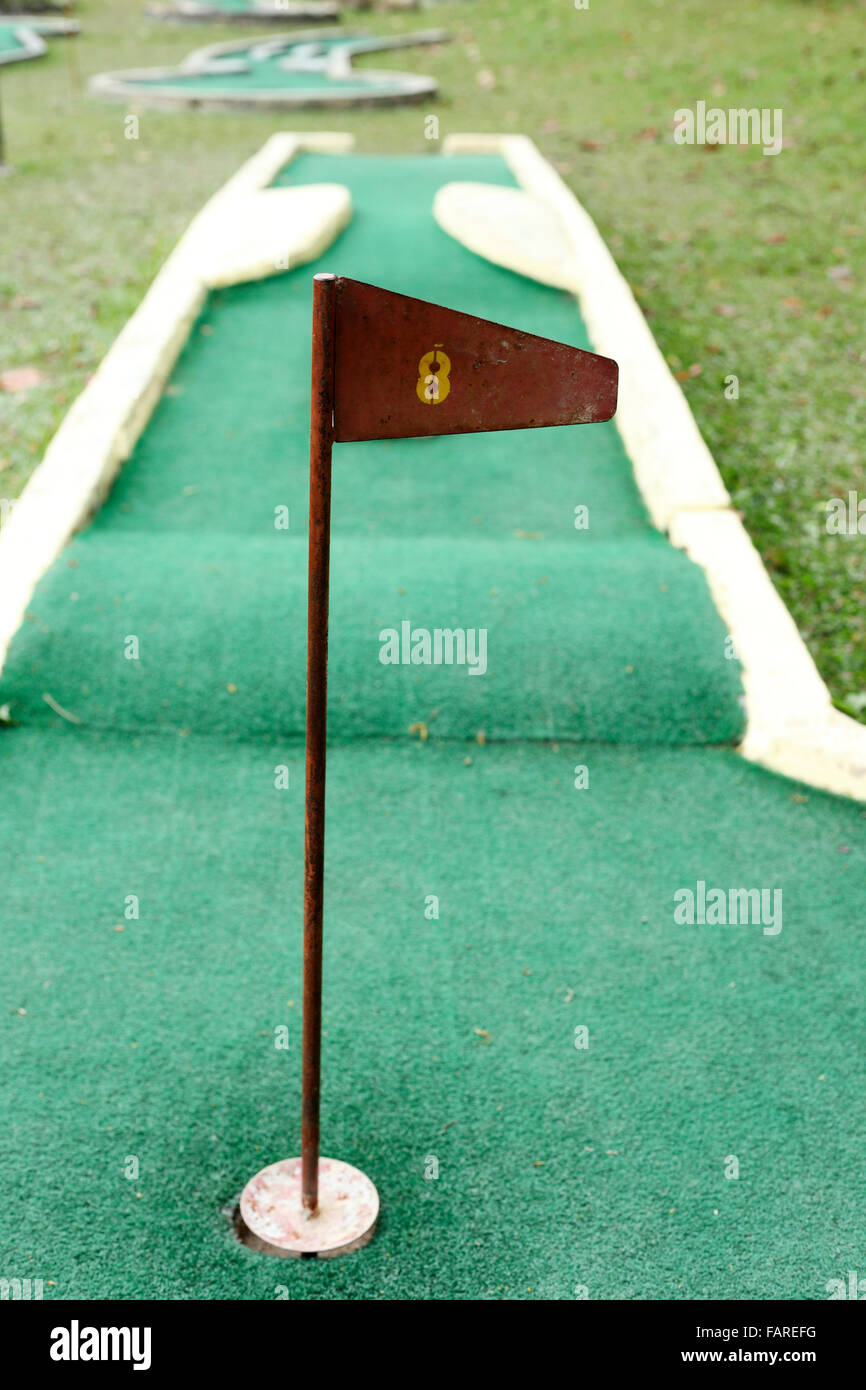 number eight flag on a mini golf course Stock Photo - Alamy