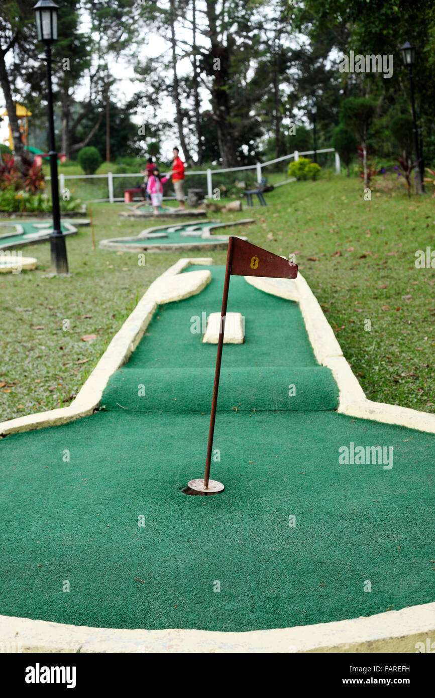 number eight flag on a mini golf course Stock Photo - Alamy