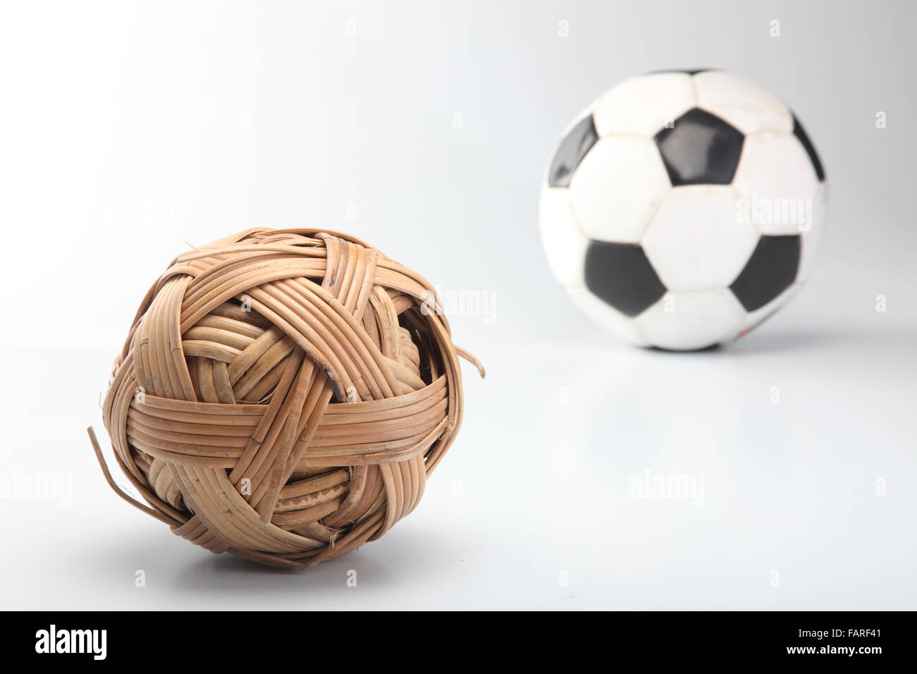 Sepak Takraw (kick volleyball) ball on plain background with soccer ...