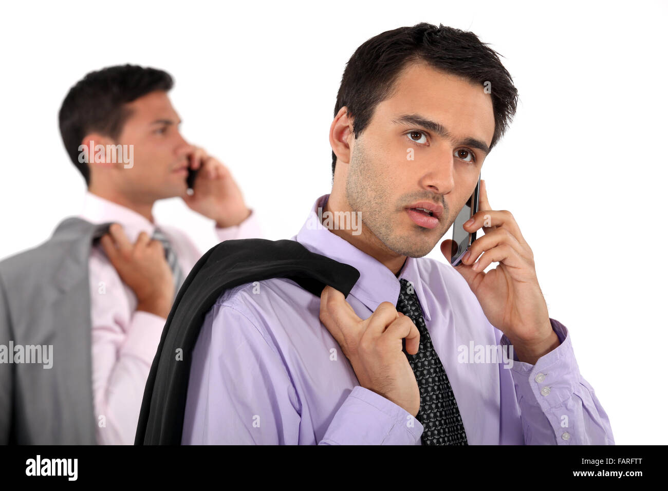 Two businessmen making telephone calls Stock Photo - Alamy