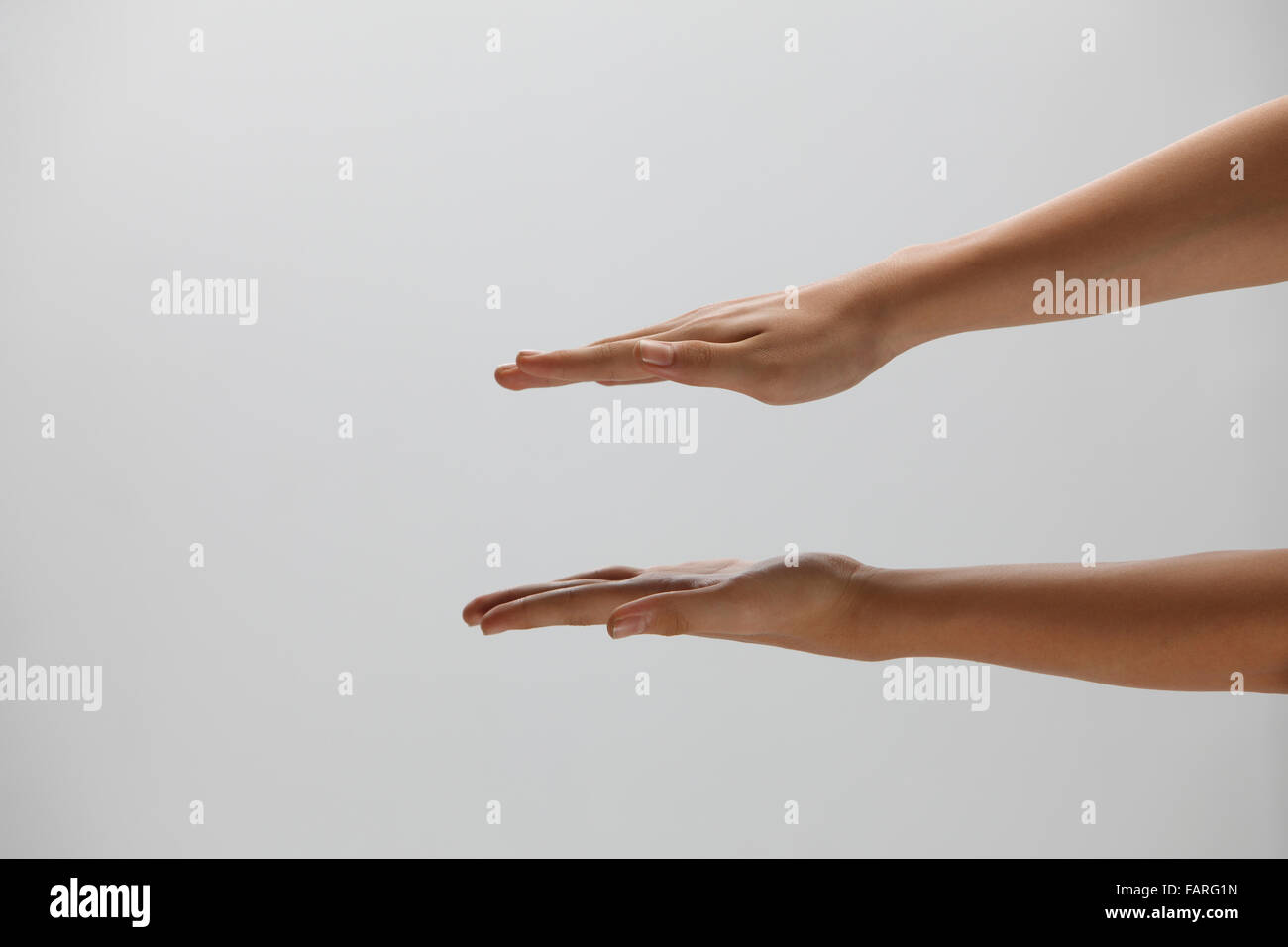 two hands for advertising space Stock Photo - Alamy