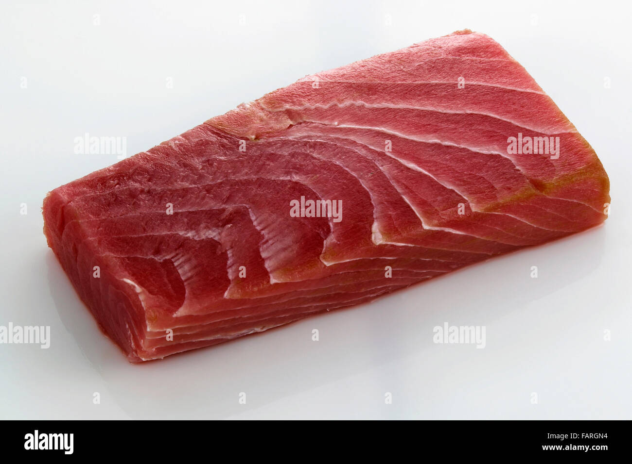 Fresh raw tuna isolated on clean background Stock Photo - Alamy