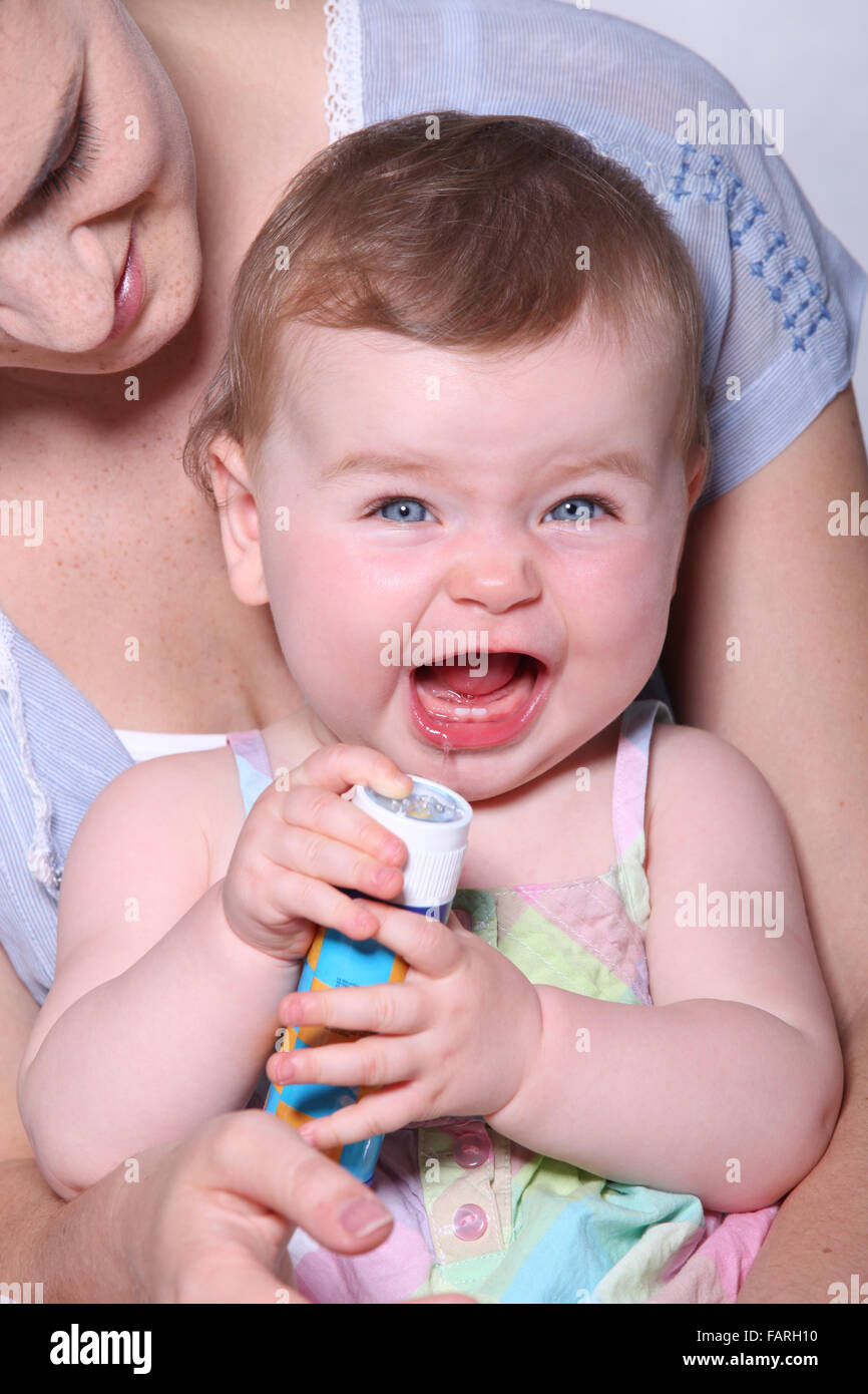 Baby making a funny face Stock Photo - Alamy
