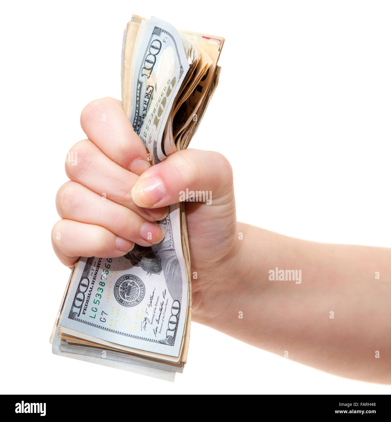 Hand holding pile of us dollar notes. All on white background Stock ...