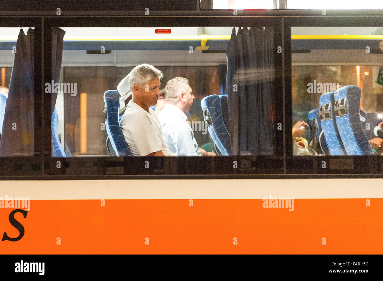 Men sitting on a bus in the coach station in Dubrovnik, Croatia, Europe ...