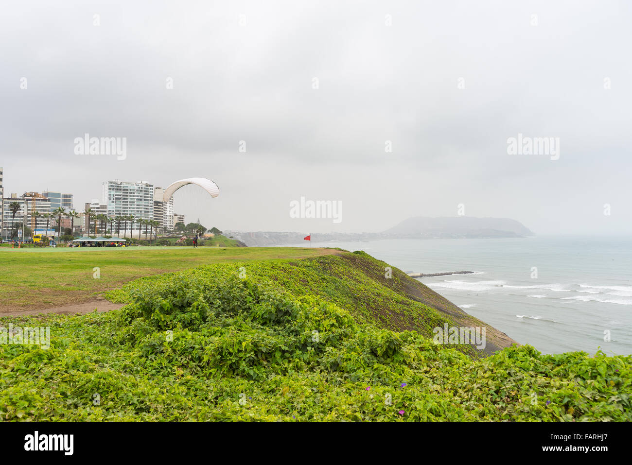 Paraglider launching from the coastline in Lima Miraflores, Peru ...