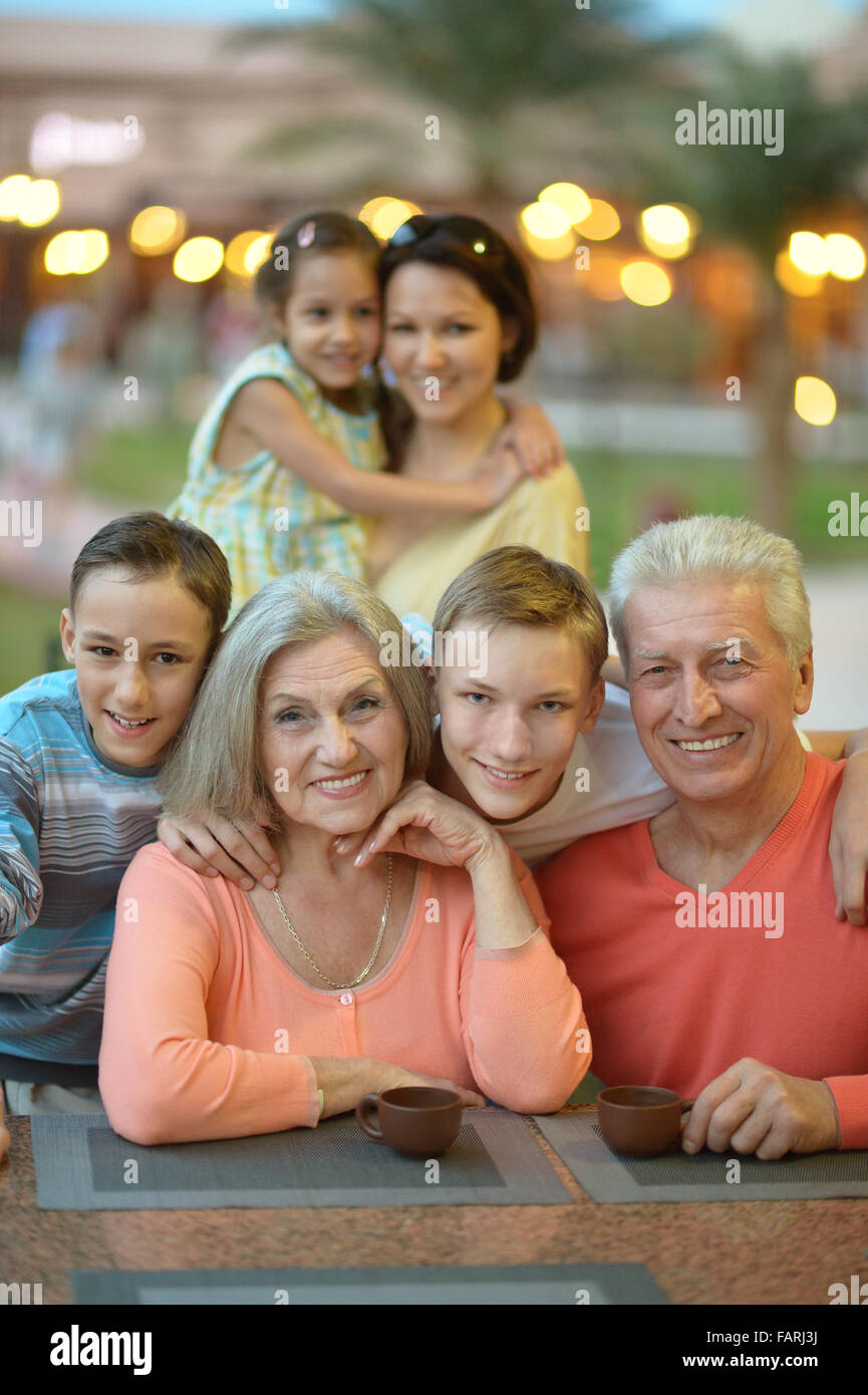 Family relaxing at resort Stock Photo - Alamy