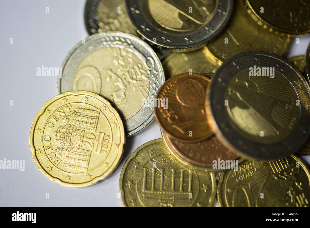 used euro coins with scratches on white background Stock Photo - Alamy