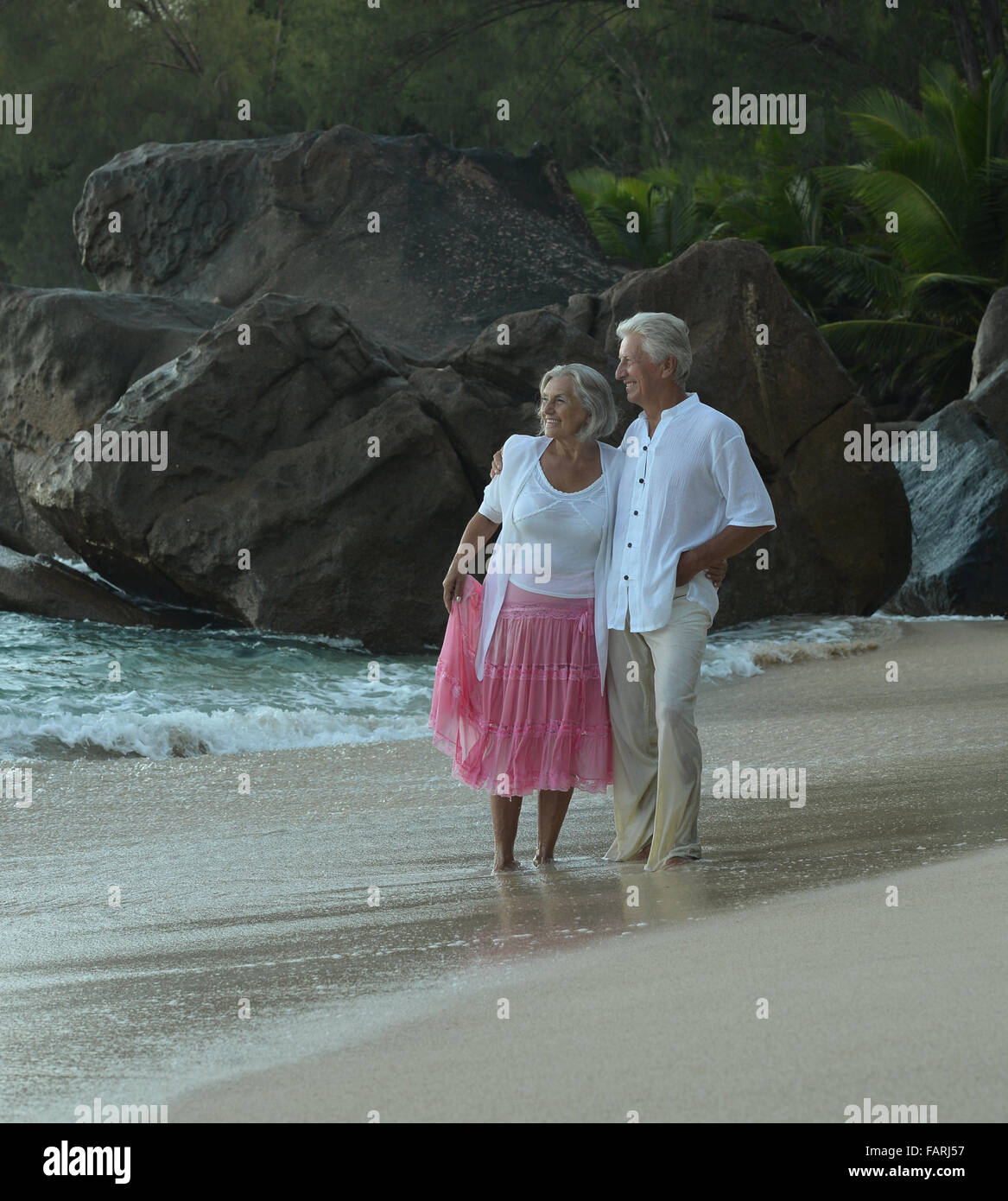 elderly couple rest at tropical resort Stock Photo - Alamy