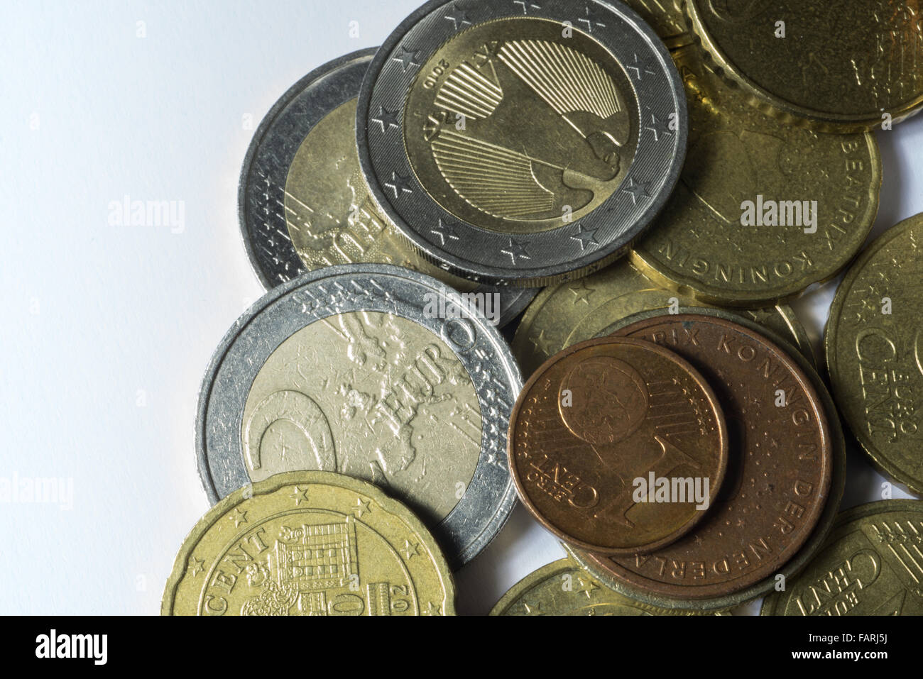 used euro coins with scratches on white background Stock Photo - Alamy