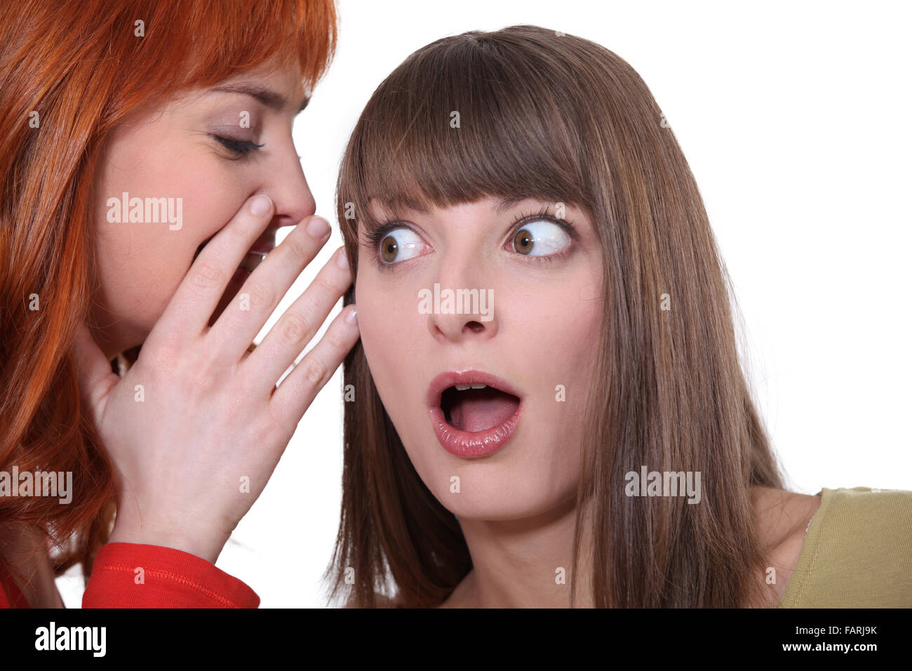 Two women gossiping Stock Photo - Alamy