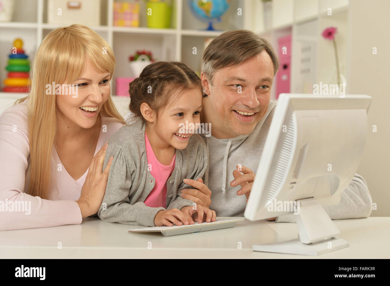 happy family playing on computer Stock Photo - Alamy