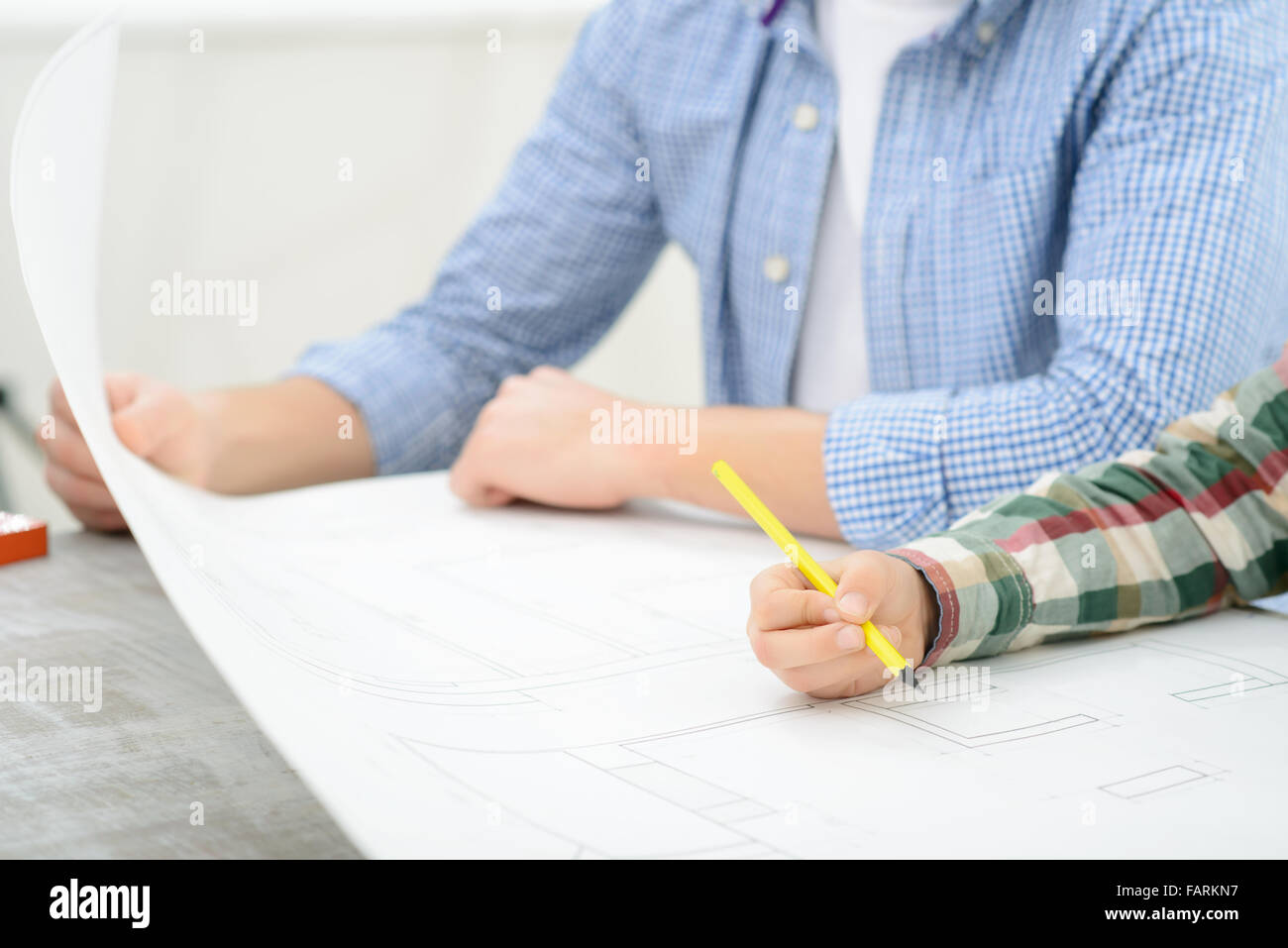Cheerful father and daughter making project Stock Photo - Alamy
