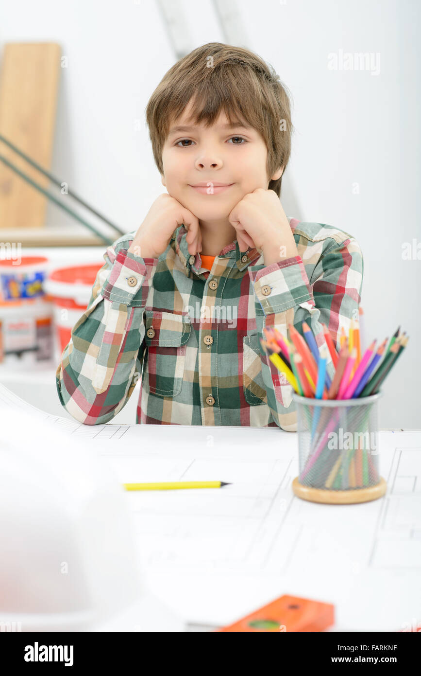 Positive kid making drawing Stock Photo - Alamy