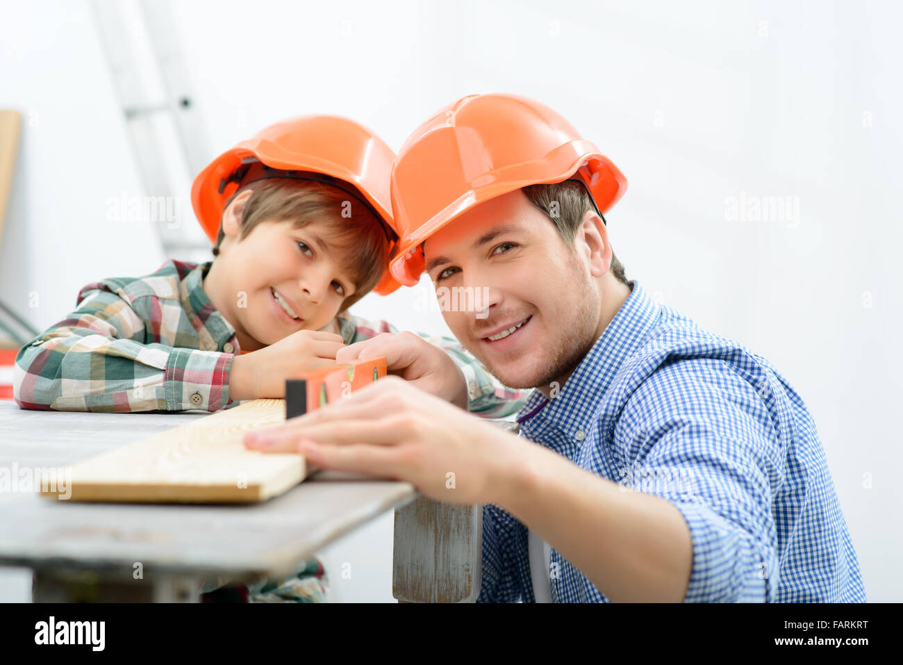 Father and son making renovation Stock Photo - Alamy