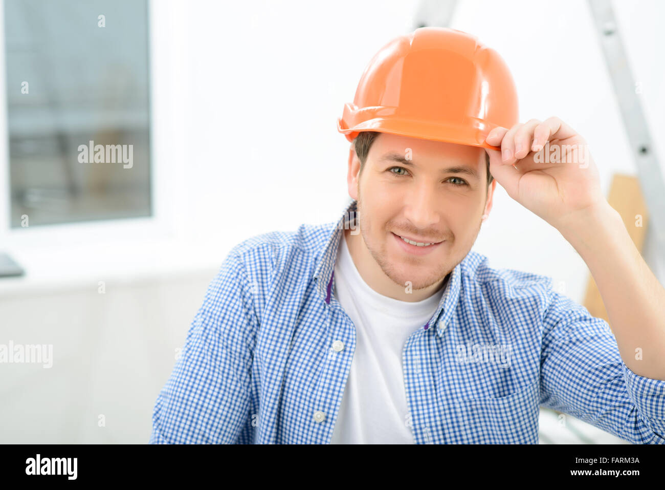 Pleasant man doing renovation Stock Photo - Alamy