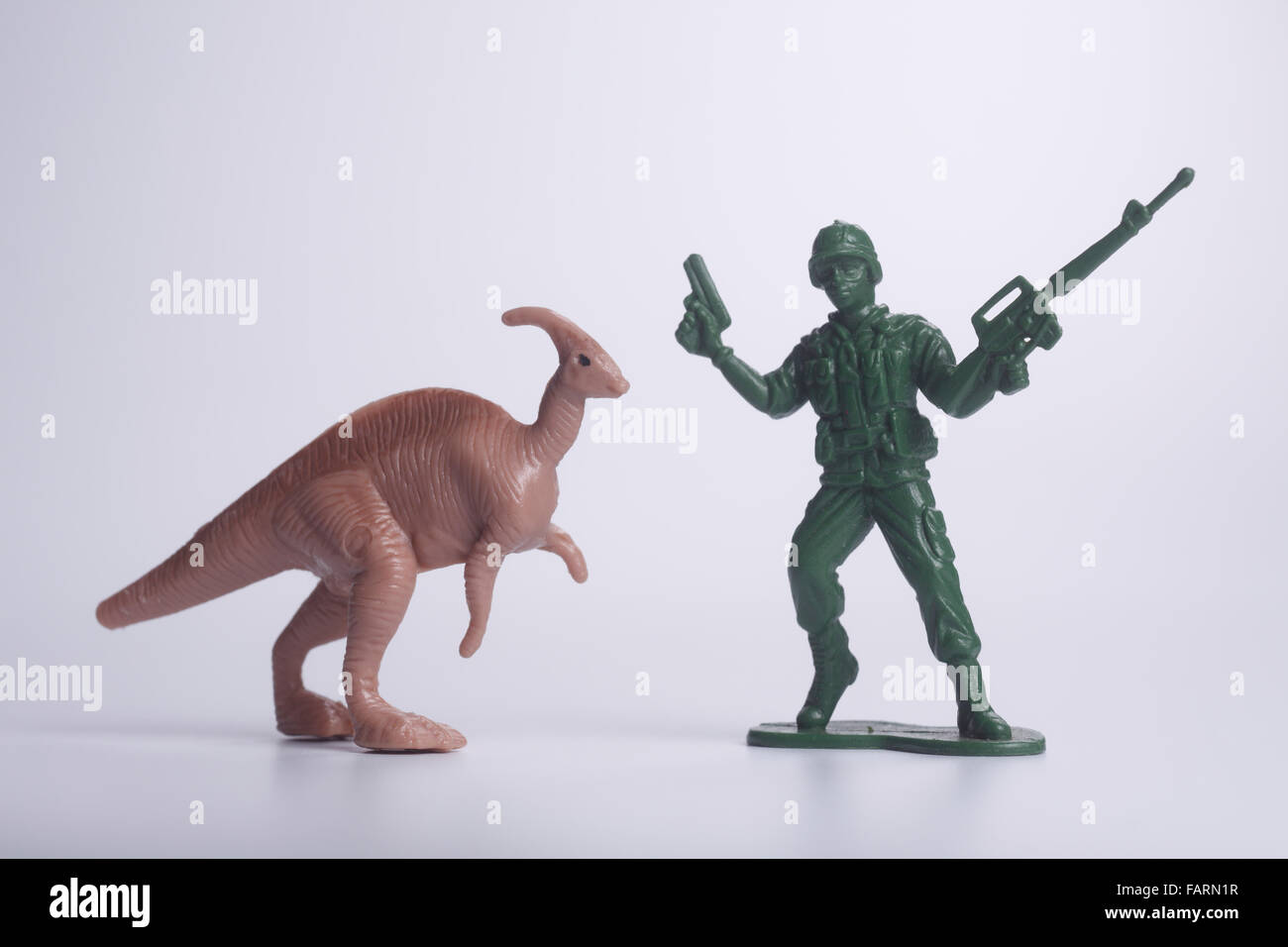 close up of the toy army and dinosaur Stock Photo - Alamy