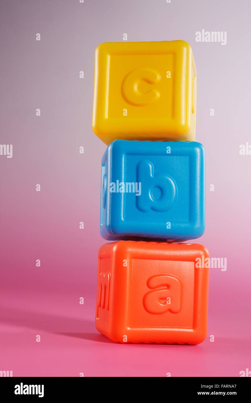 A verical stack of toy blocks Stock Photo - Alamy