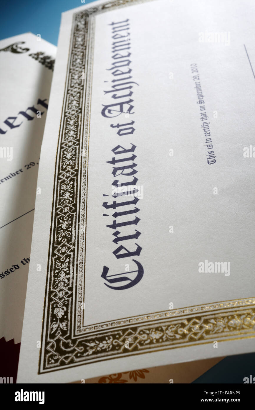 Certificate on the blue table Stock Photo - Alamy