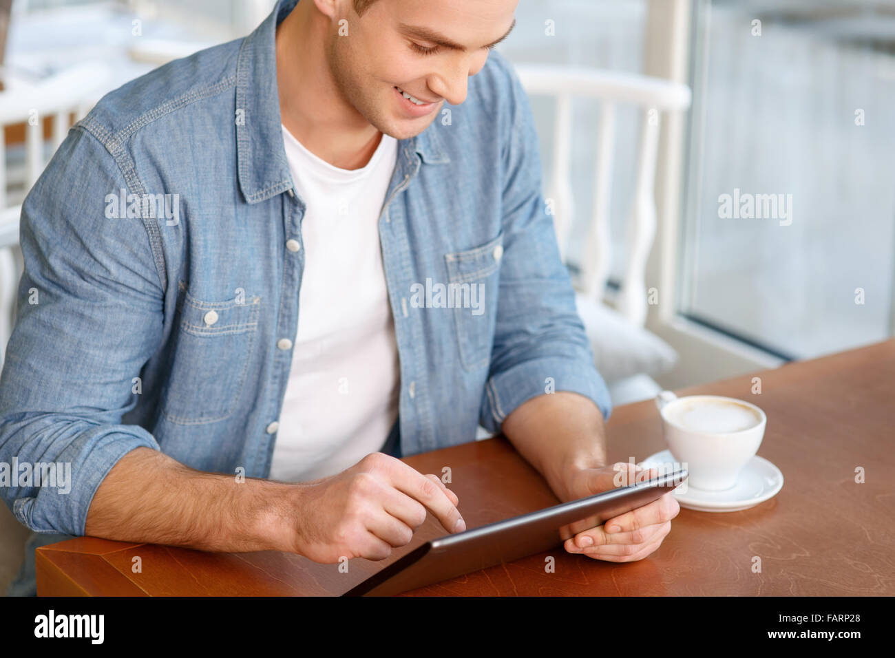 Handsome man sitting in the cafe Stock Photo - Alamy