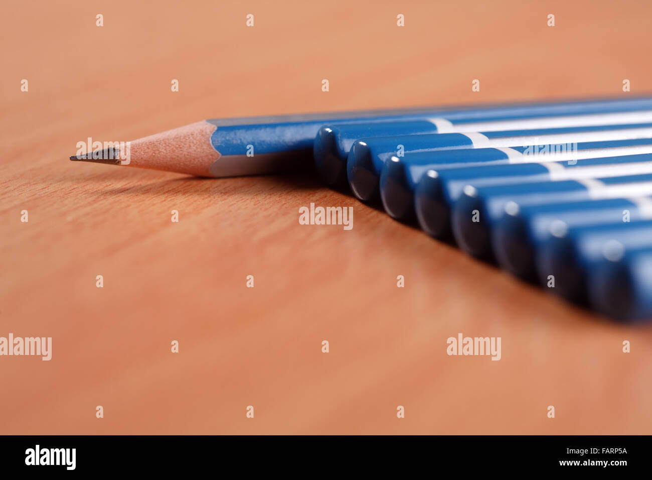 A sharpened pencil among a row of blunt end pencils Stock Photo - Alamy