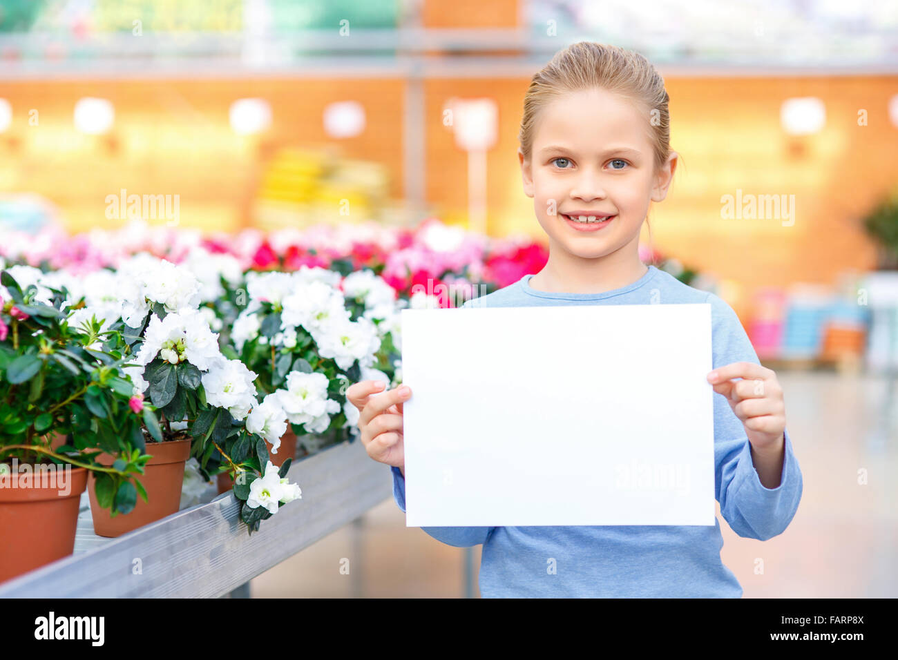 Little girl upholding a paper Stock Photo - Alamy