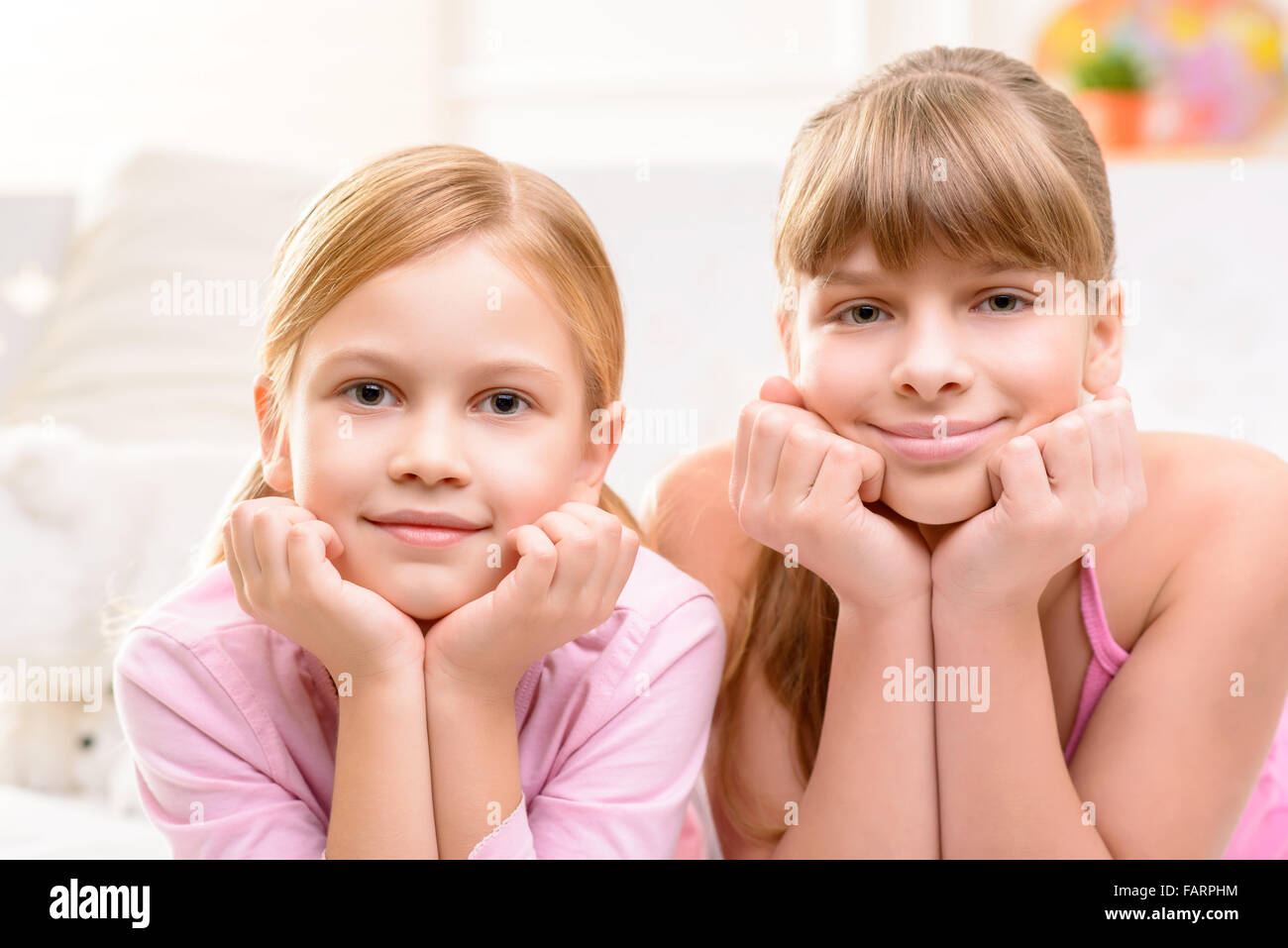 Pretty sisters having fun at home Stock Photo - Alamy