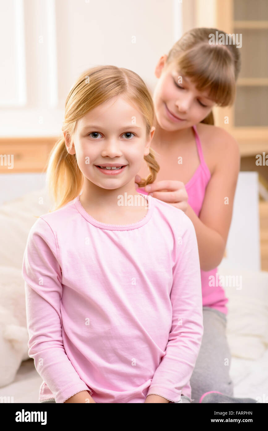 Pretty sisters having fun at home Stock Photo - Alamy