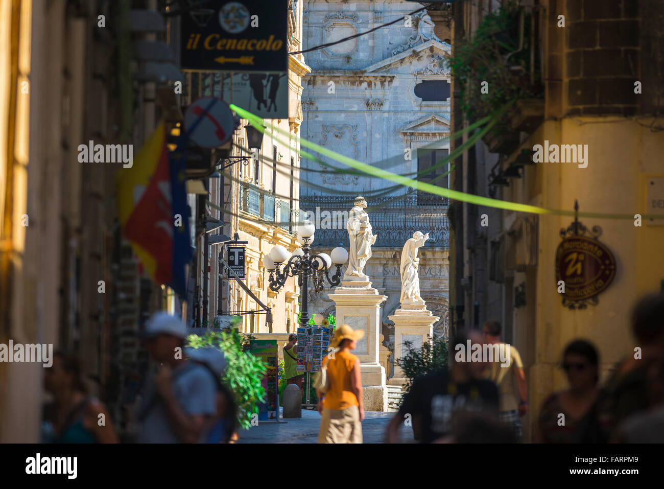 Ortigia Sicily, view in summer of people walking along the Via Saverio ...