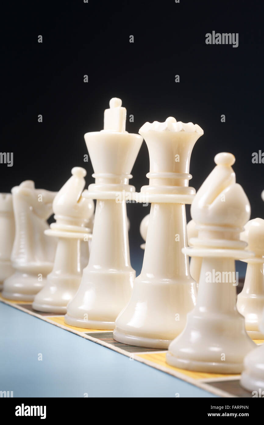 chess pieces on a board showing concept for strategy Stock Photo - Alamy