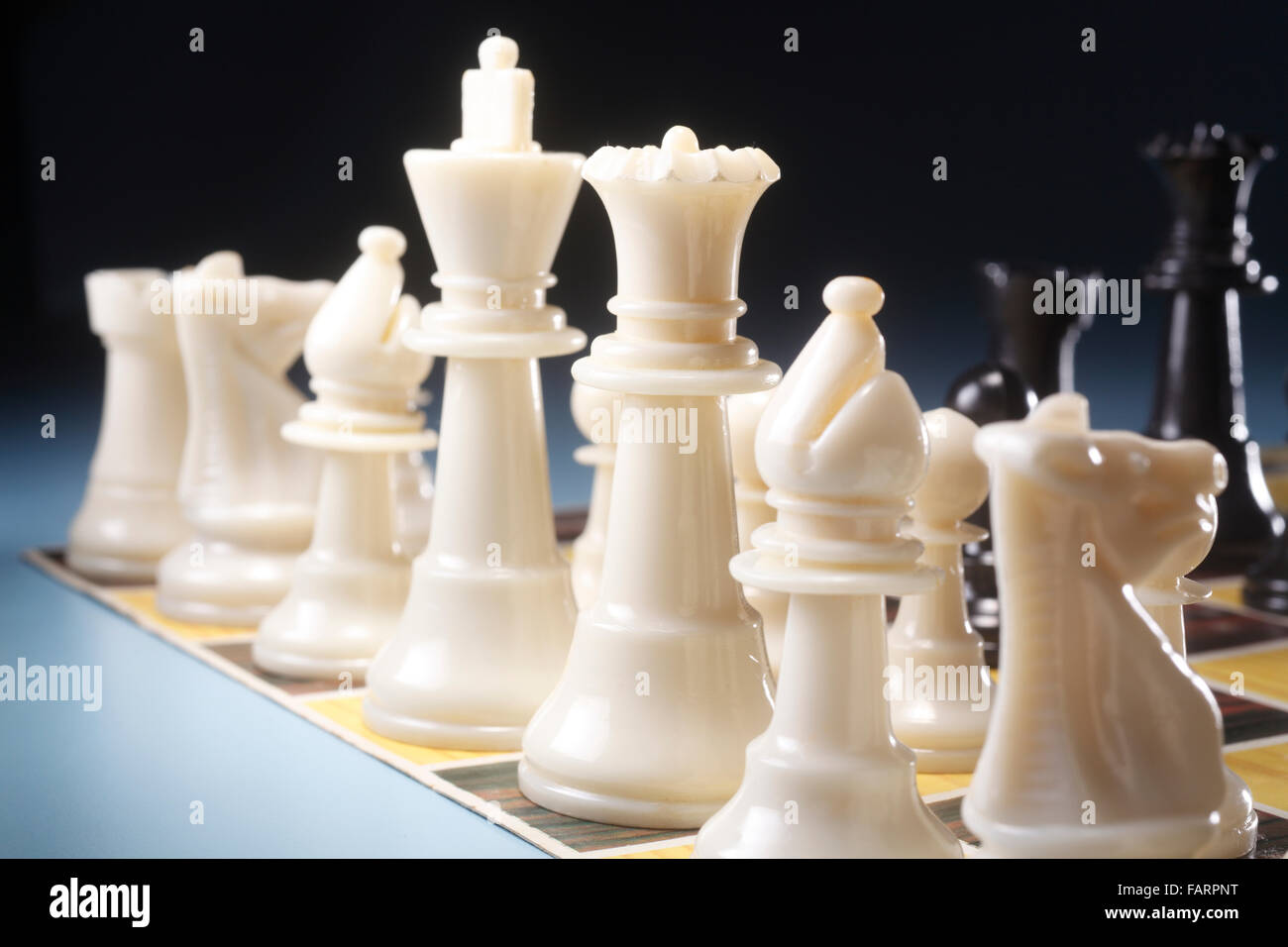 chess pieces on a board showing concept for strategy Stock Photo - Alamy