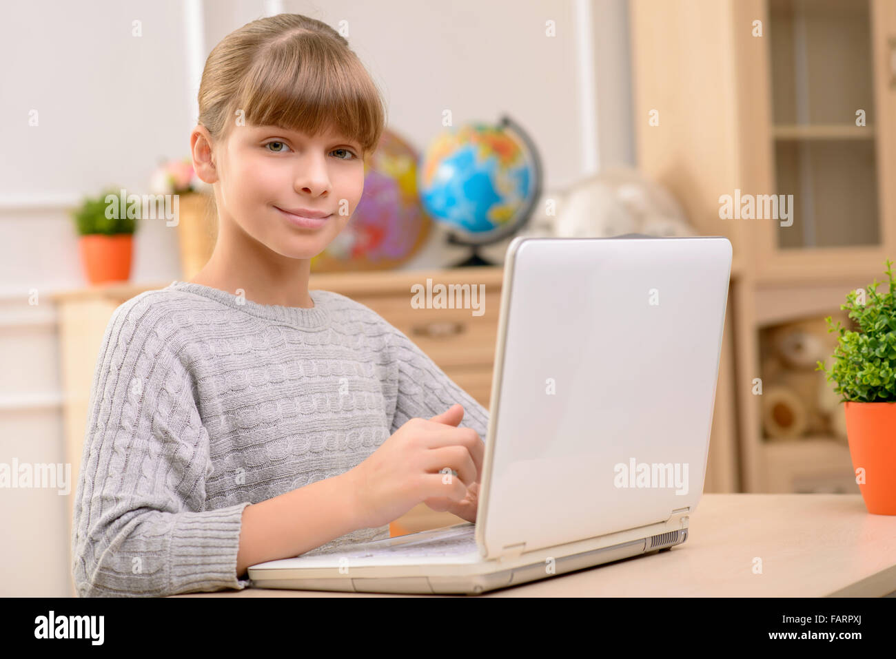 Pretty girls sitting at the table Stock Photo - Alamy