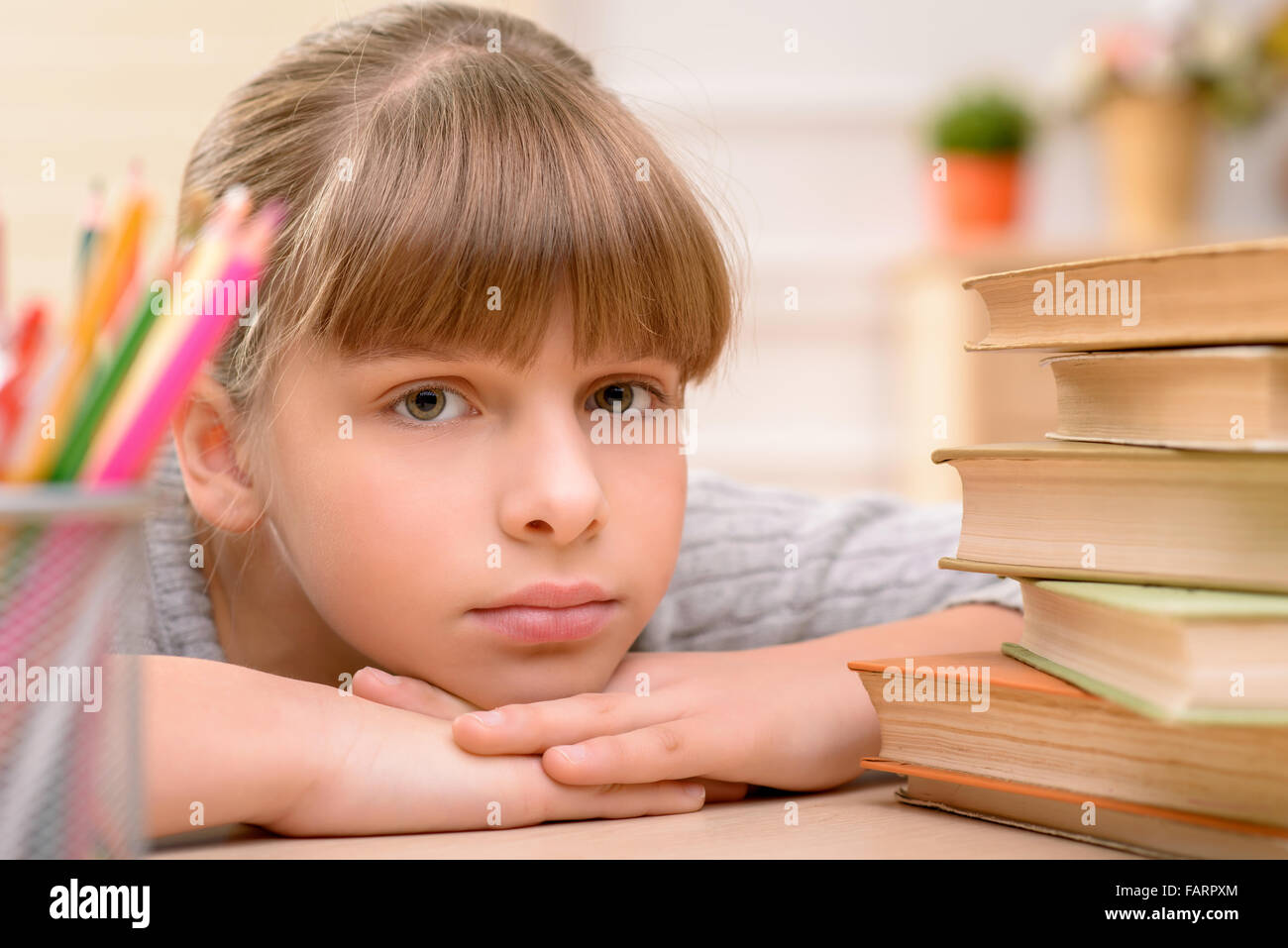Pretty girls sitting at the table Stock Photo - Alamy