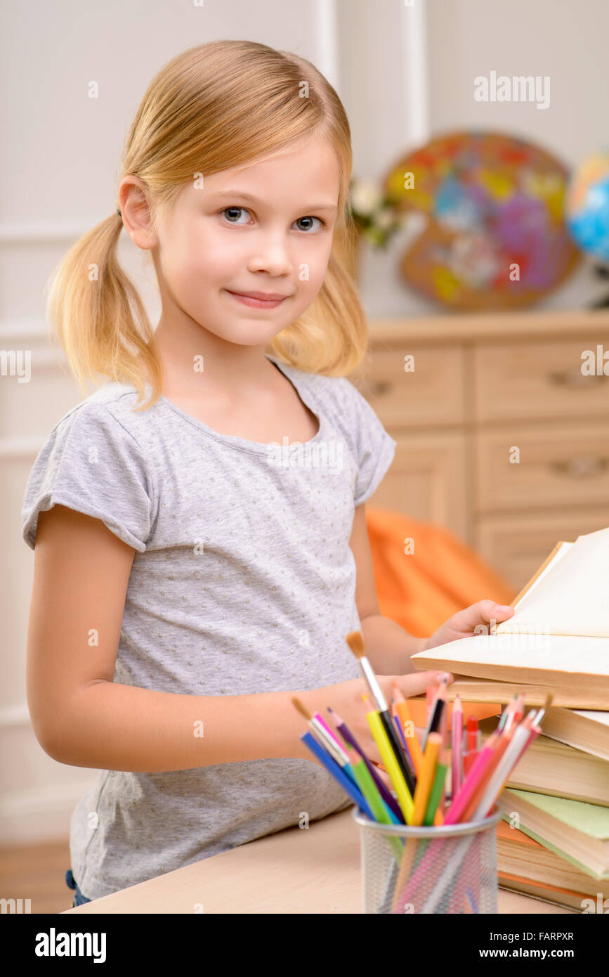 Pretty girls sitting at the table Stock Photo - Alamy