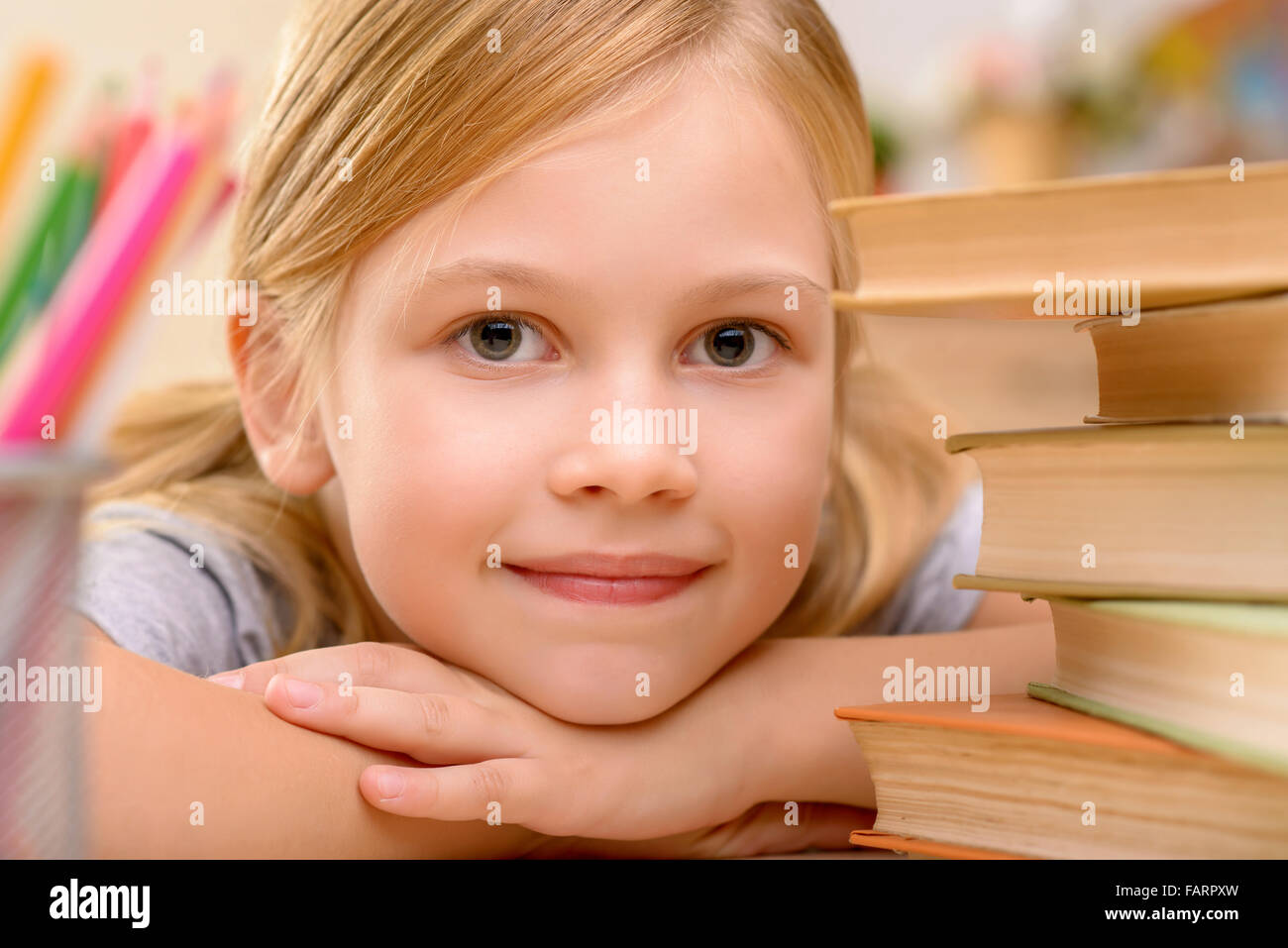 Pretty girls sitting at the table Stock Photo - Alamy