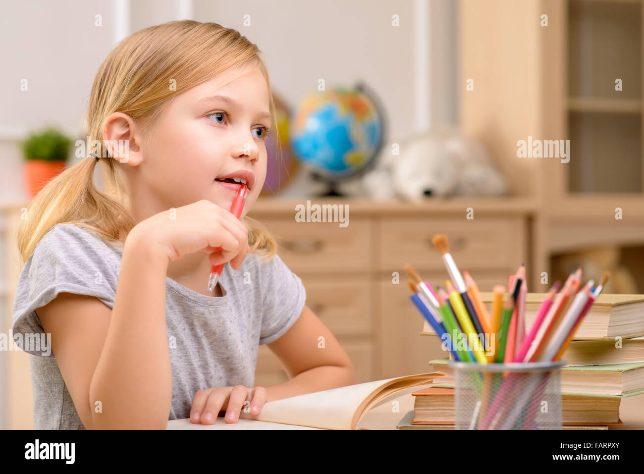 Pretty girls sitting at the table Stock Photo - Alamy