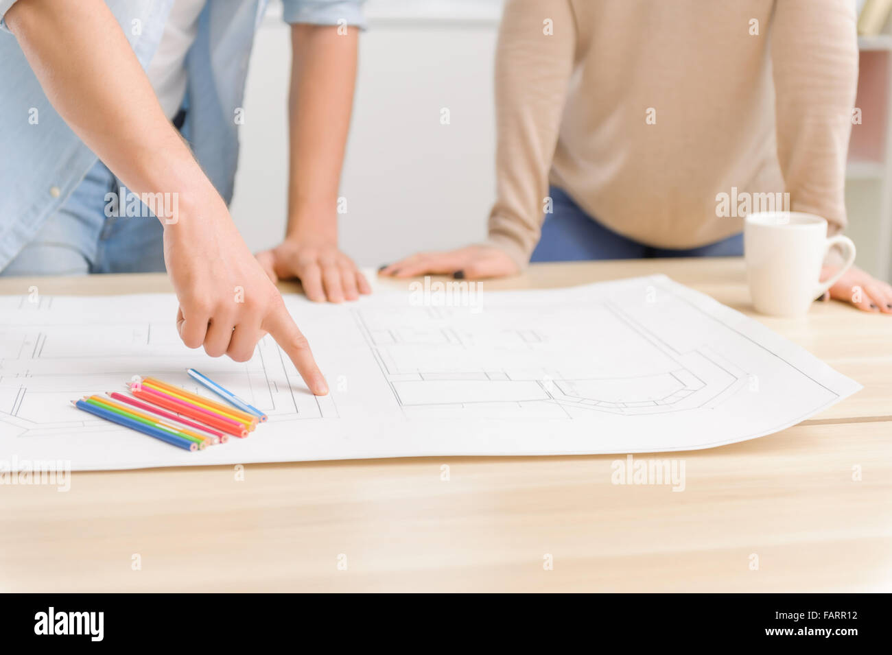 Two positive partners are modelling a drawing Stock Photo - Alamy