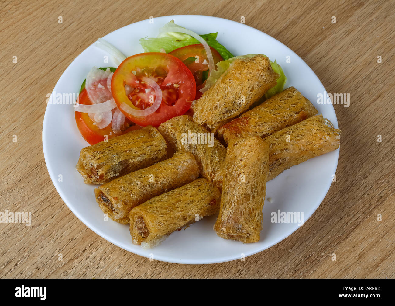 Asian traditional spring rolls on the wood background Stock Photo - Alamy